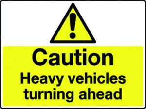 Caution Heavy vehicles turning ahead sign | Aura Sign Shop